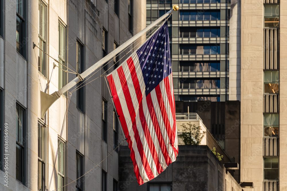 American flag hanging outside hi rise building Stock Photo | Adobe Stock