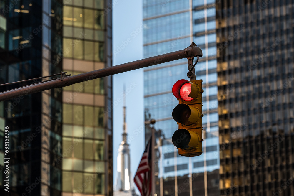 Traffic light on city street with high rise buildings Stock Photo ...