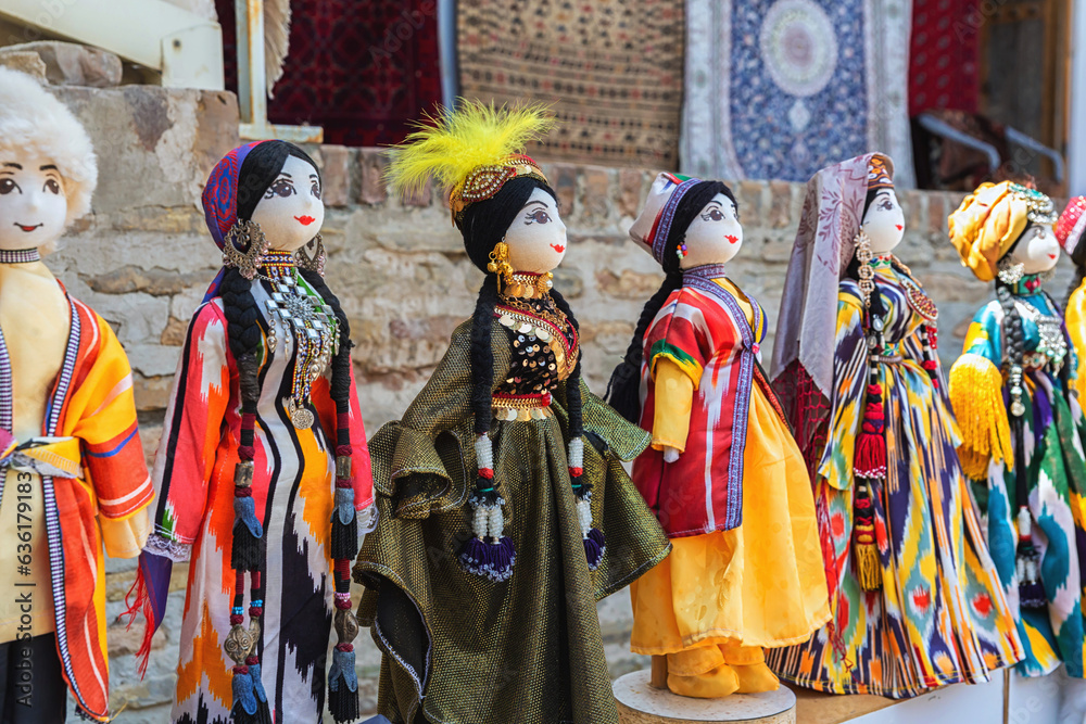 Dolls dressed in traditional uzbek costumes. Traditional souvenir ...