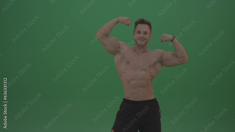 Blonde bodybuilder demonstrating front double biceps and lateral spread ...