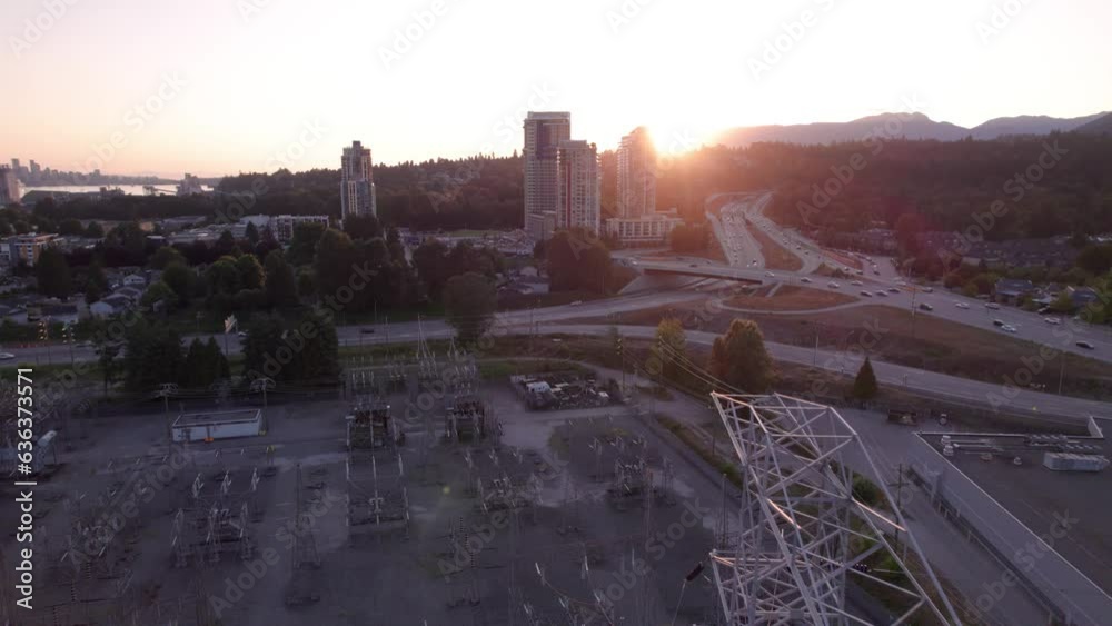 Stockvideo High voltage power transmission tower and lines near a ...