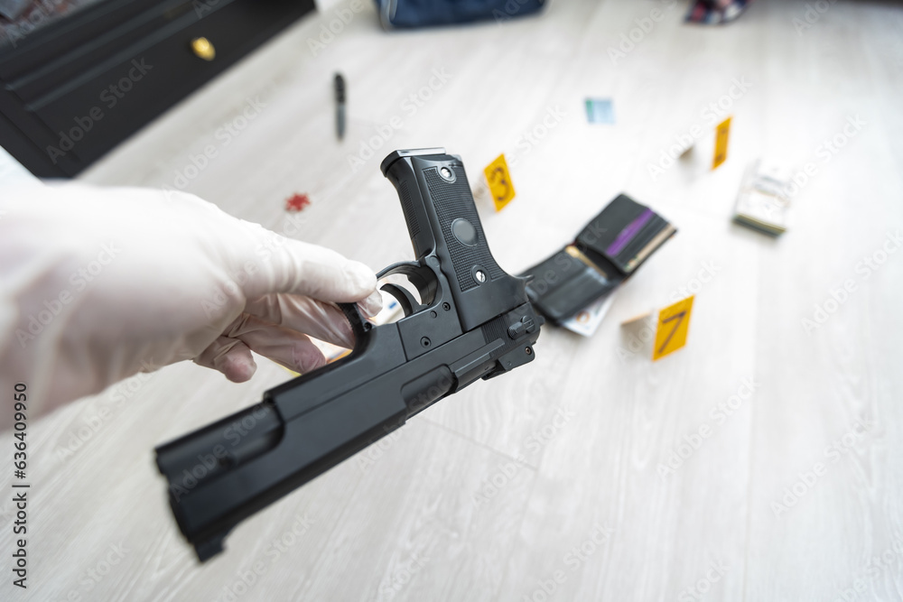 Crime scene investigation - collecting bullet of pistol on the ground ...