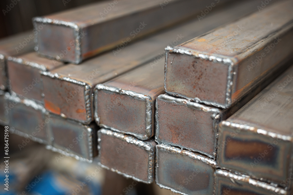 welded metal profile, blocked iron pipe with little rust Stock Photo ...