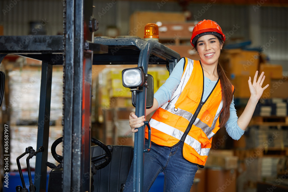 female worker smiling and say hello or goodbye pose to someone beside ...