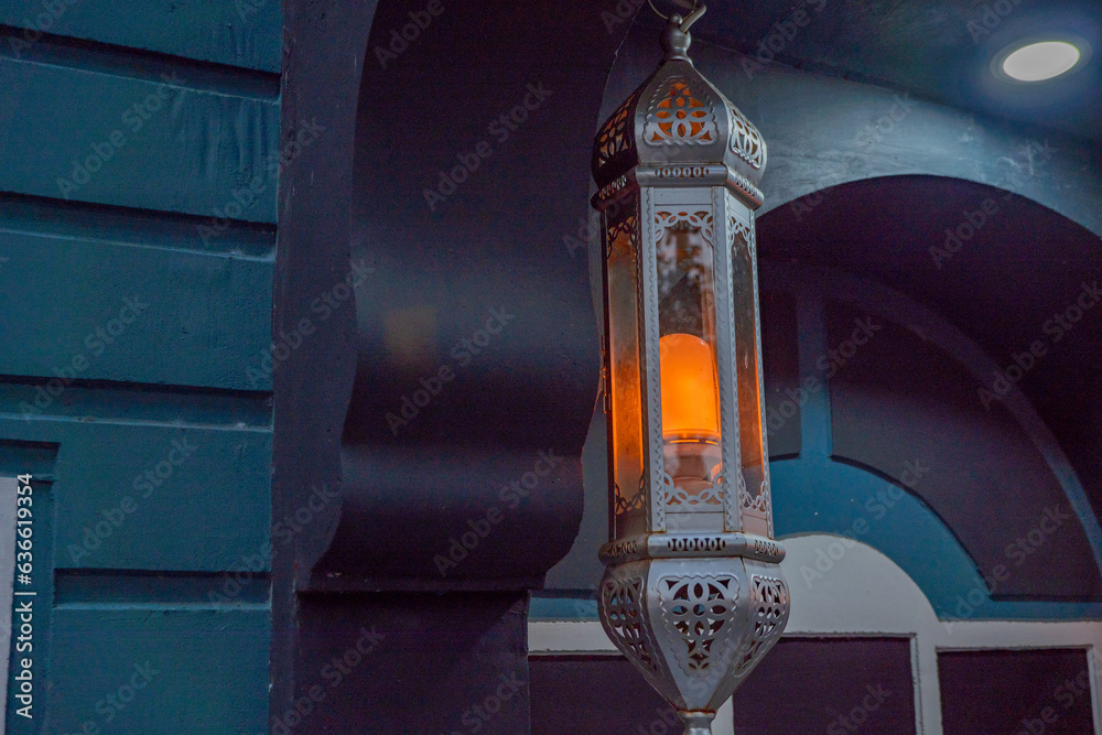 Outdoor lampion on the wall entrance door with Ramadhan vibes. The ...