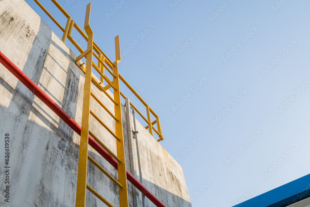 Ledder and cage rail on the wall power plant industry. The photo is ...