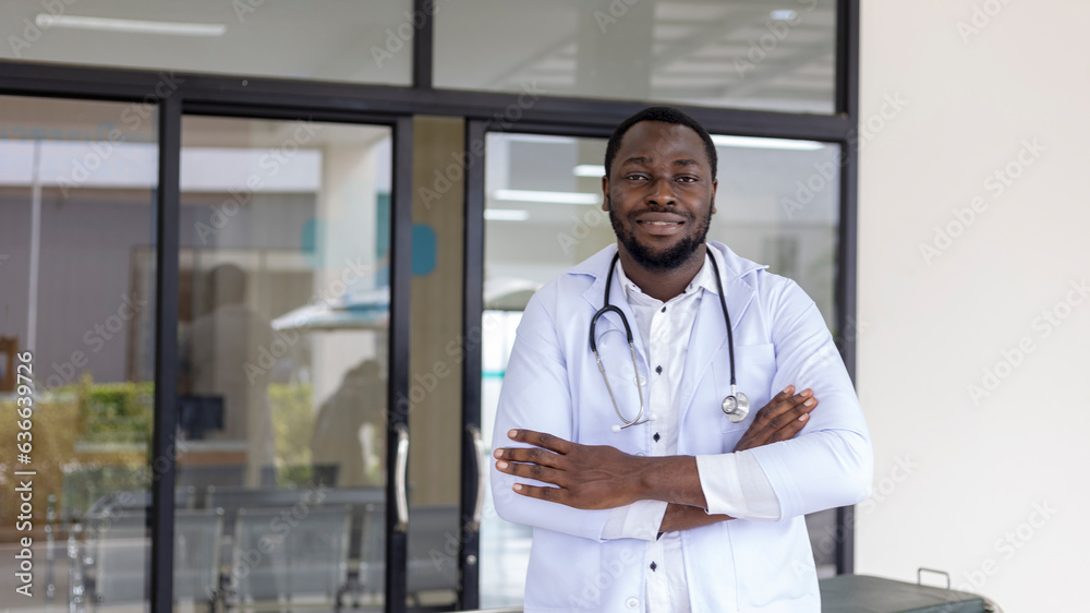 African surgical doctor in white gown stands with smiling face and ...