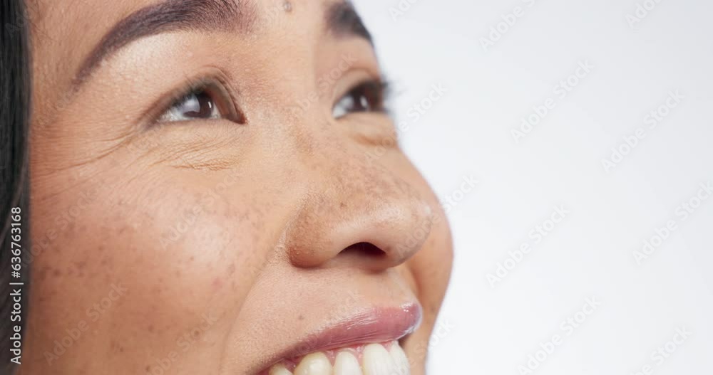 Thinking, happy and Asian woman in face closeup in studio isolated on a ...