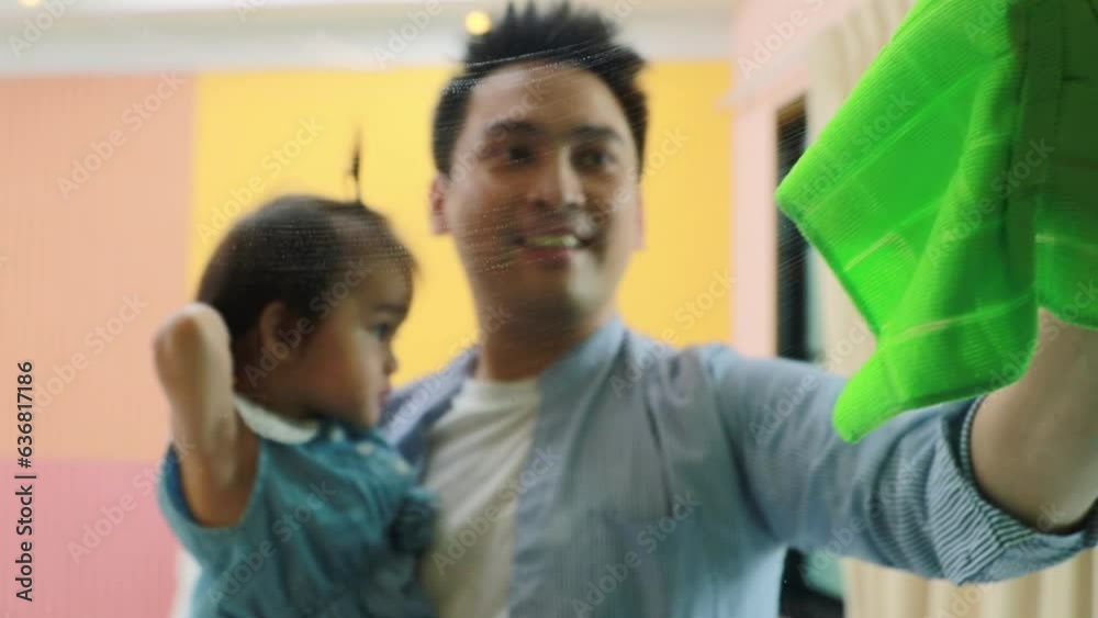 Father's household housework routine chores used a clean cloth to wipe ...