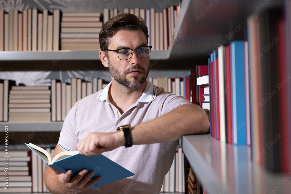 Portrait of professor with book in classroom. Handsome professor in ...