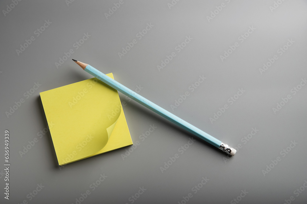 Blank sticker for notes on gray background with pencil. Sticky note ...