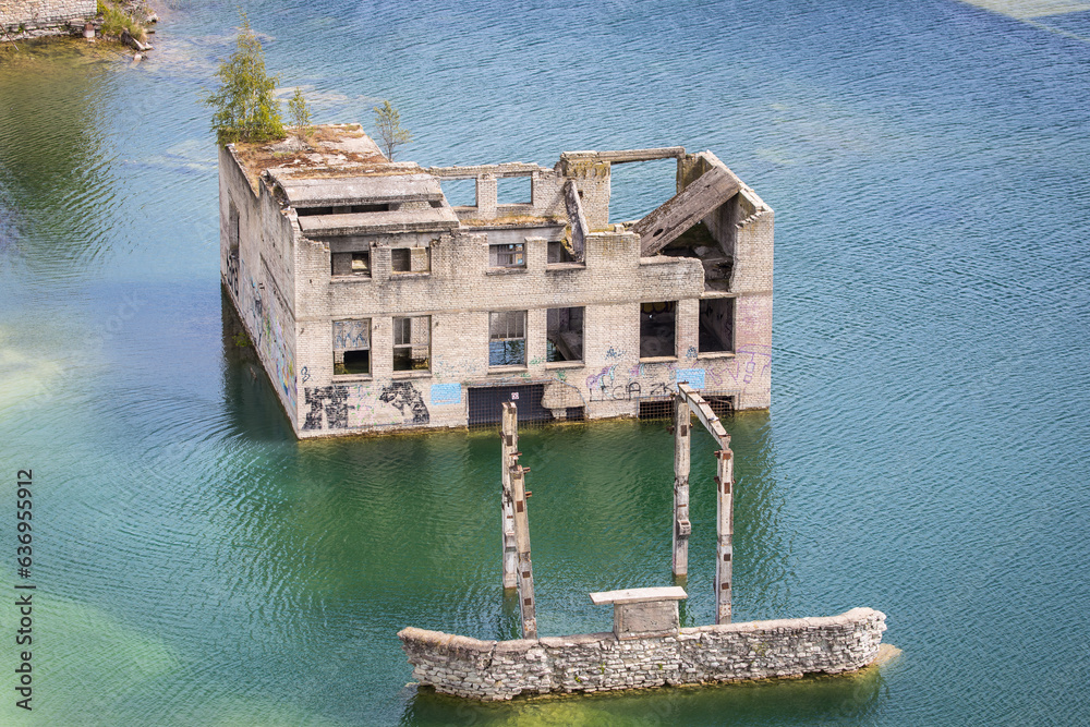 Flooded abandoned ruin building of former jail in Rummu, Estonia as ...