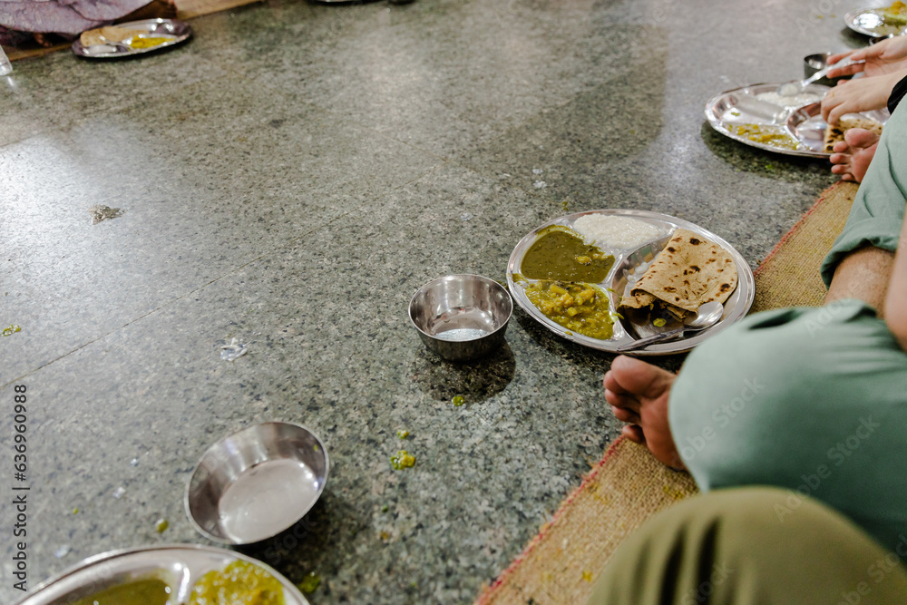 People voluntarily serving langar in India, Asia. Langar is a practice ...