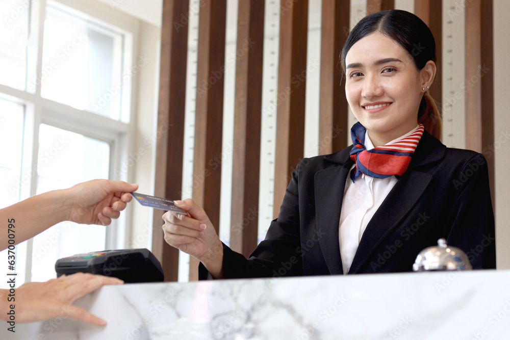 Happy smiling young beautiful Asian woman female receptionist in black ...