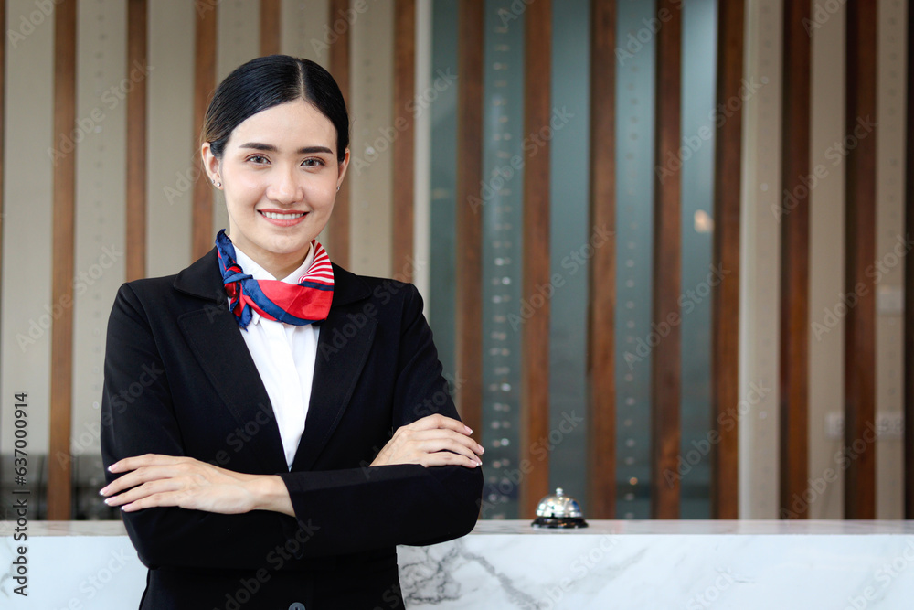 Portrait of happy smiling young beautiful Asian female receptionist in ...