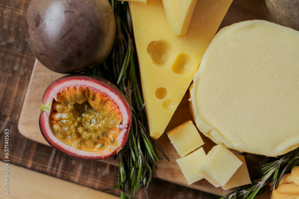Cheese platter with fruits.Cheese board. assorted cheese on a wooden ...