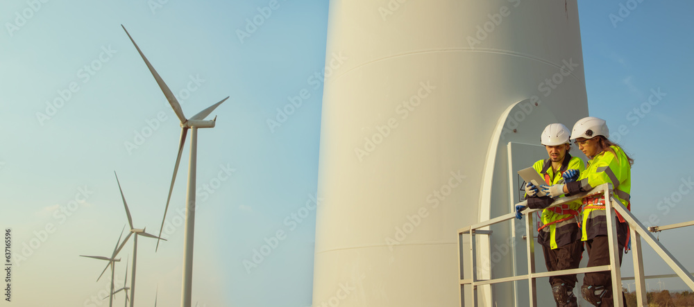 Technician working outdoors, wind farm professional team male and ...