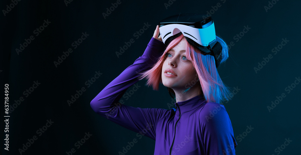 Beautiful woman in futuristic costume with flowing hair while touching ...