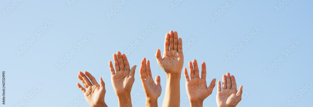 People raising hands for participation, many people's hands up. sky ...