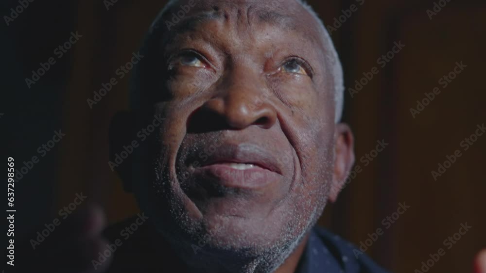 Close-up face of One senior black man looking up at sky pleading for ...