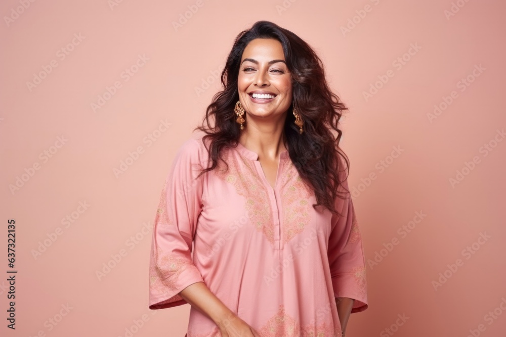 Medium shot portrait of an Indian woman in her 40s wearing kurta pajama ...