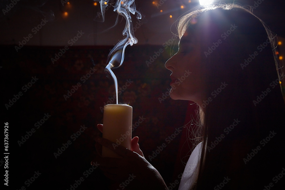 Beautiful arabian girl with candles in red room full of rich fabrics ...