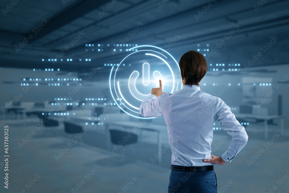 Back view of man hand using glowing digital power button on blurry ...