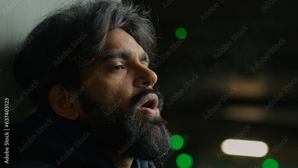 Helpless homeless Indian depressed stressed bearded man suffer at dark ...