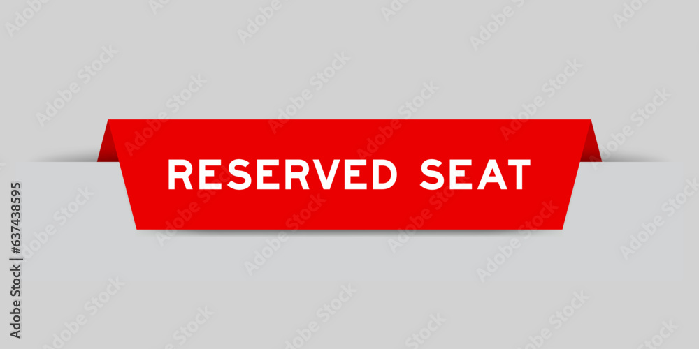 Red color inserted label with word reserved seat on gray background ...