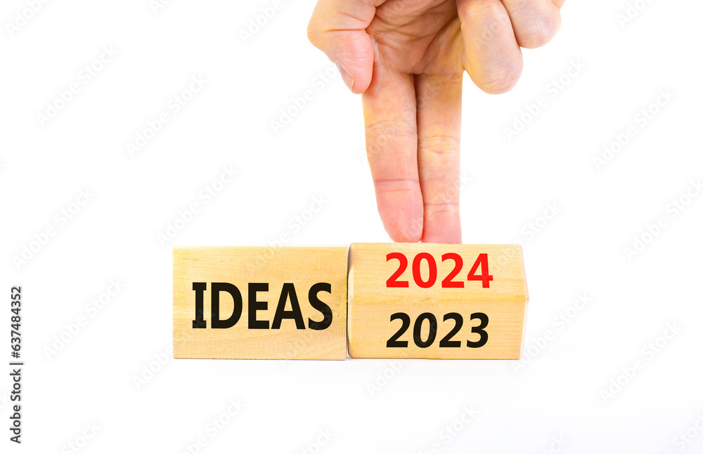 2024 ideas new year symbol. Businessman turns a wooden cube and changes ...