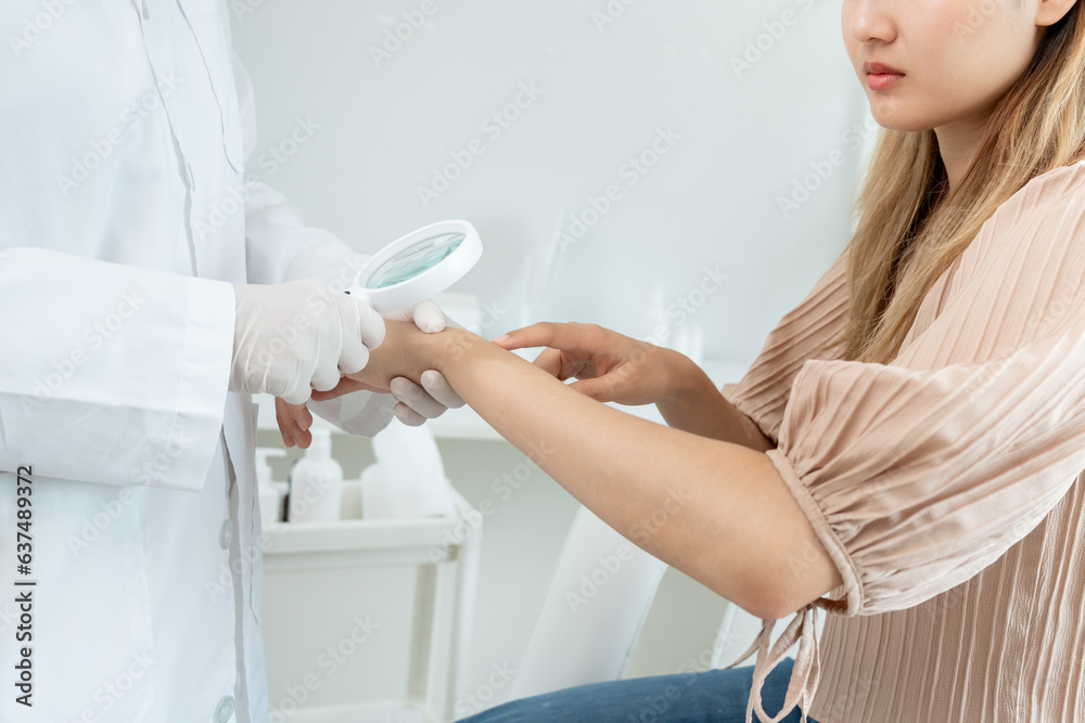 skin problem and beauty of asian girl. Dermatologist use magnifying ...