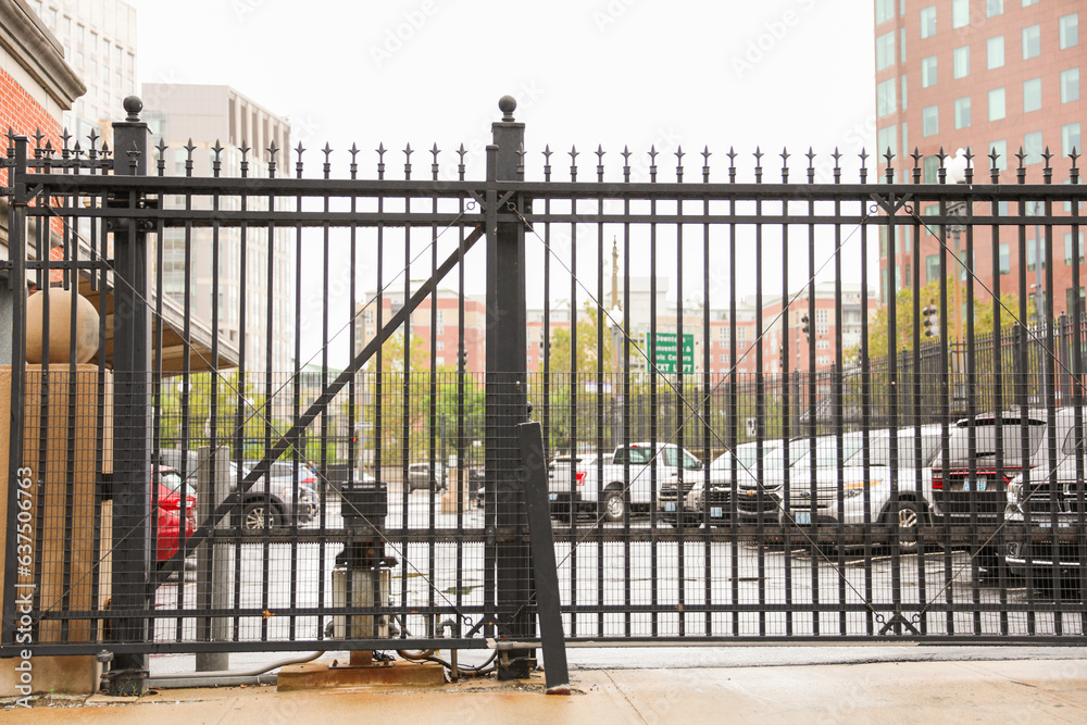Metal fence: Symbol of boundaries and security; conveys separation and ...
