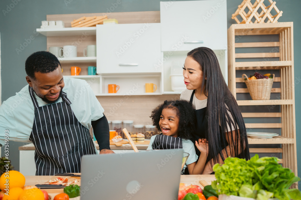 Kind African american parents teaching their adorable daughter how to ...