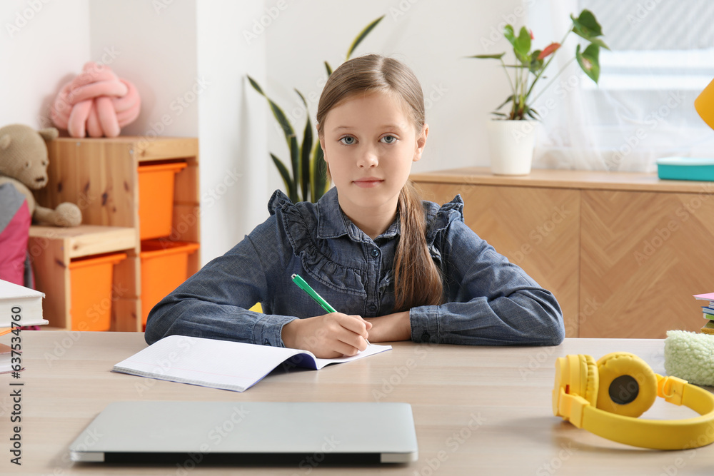 Little girl doing lessons at home Stock Photo | Adobe Stock