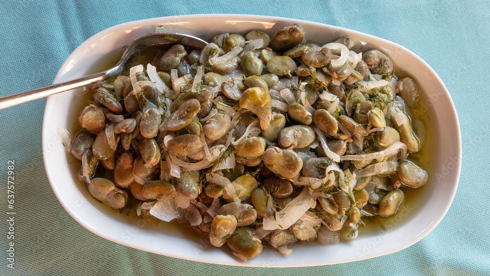 Traditional Turkish food; Fresh broad bean salad with olive oil, broad ...