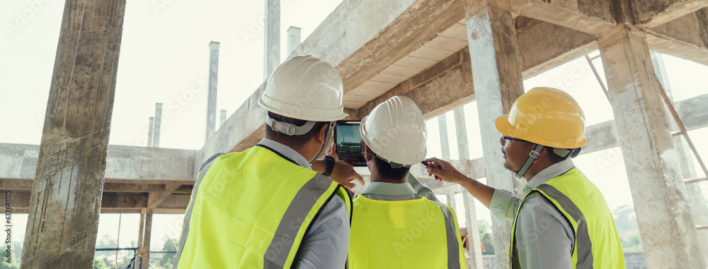 Civil Engineer and Contractor working in construction site. Team ...