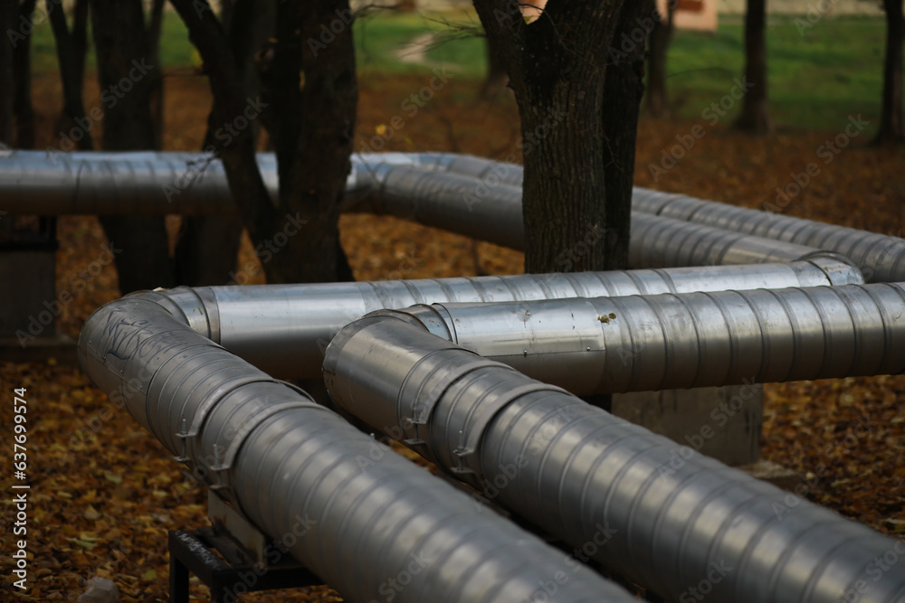 Metal pipes on the street. pipes from the pipeline. gas pipeline for ...
