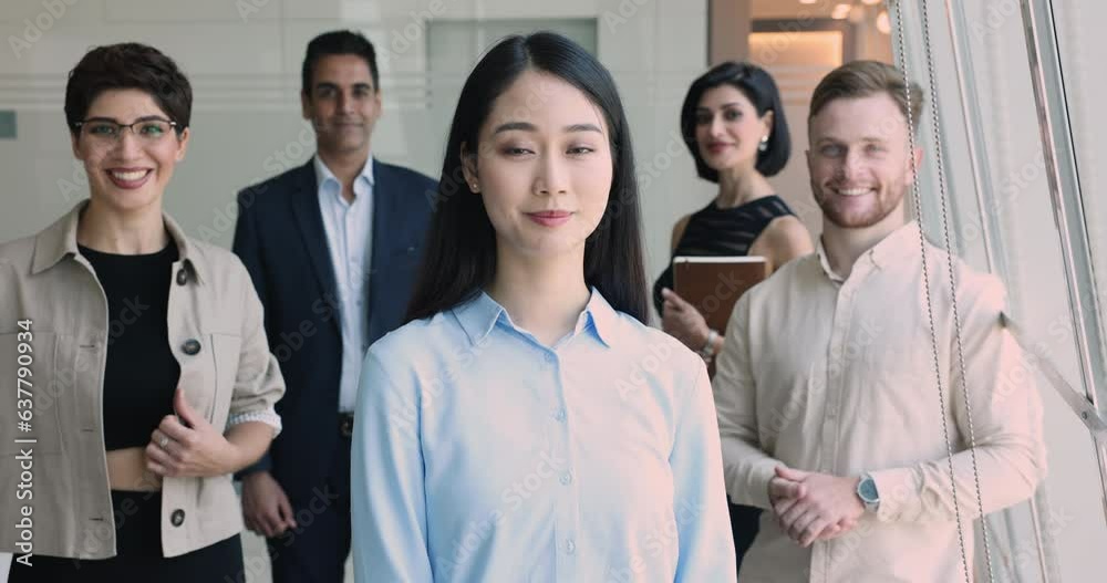Smiley successful young Asian woman, team leader, boss, female intern ...