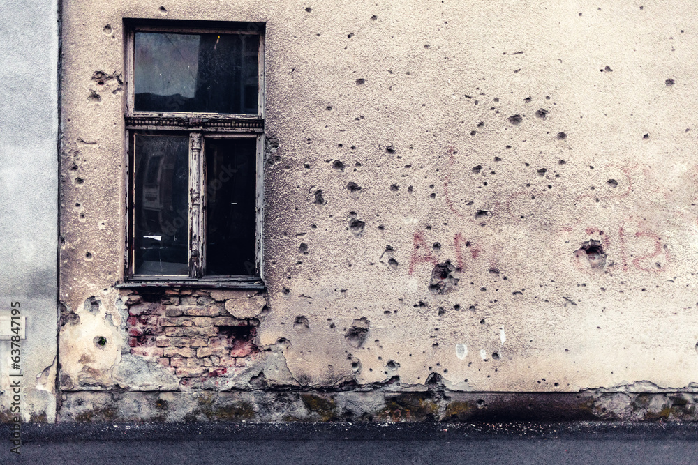 Damaged building in Ukraine war. Historic war damage, bullet holes in ...