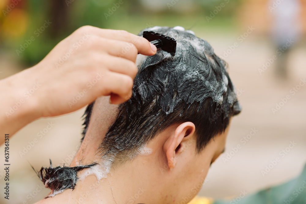 Asian man shaving his head by elder monk before ordain ceremony, Study ...