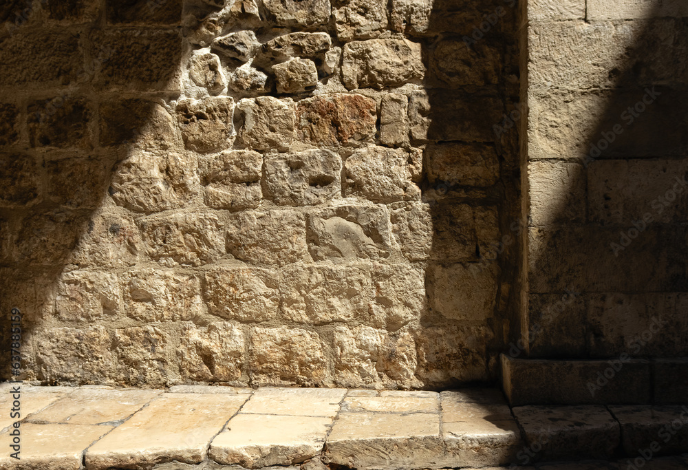 Grunge background. The shadow of the sun on the wall of an old stone ...