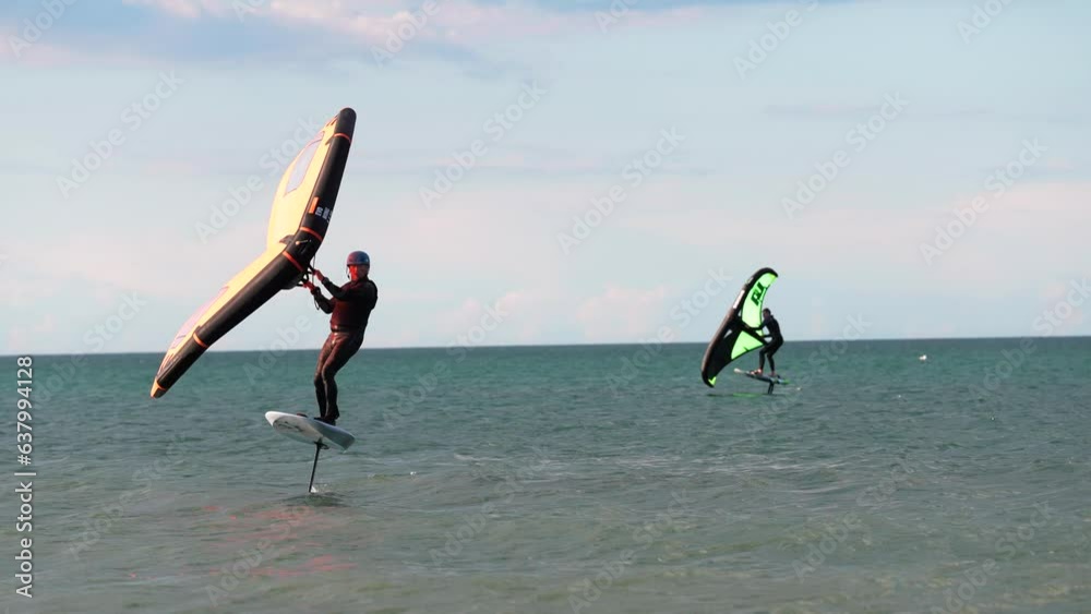 Modern water sport. Hydrofoil ride on the ocean using the wing and the ...