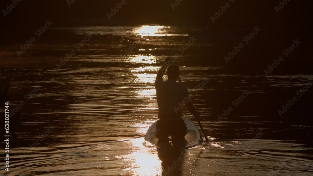 Sap board with a silhouette of a young man, rear view. An athlete is ...