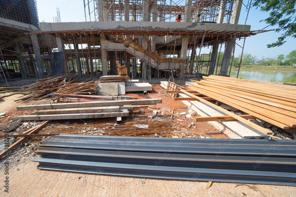 Busy industrial under construction site workers working with cranes and ...