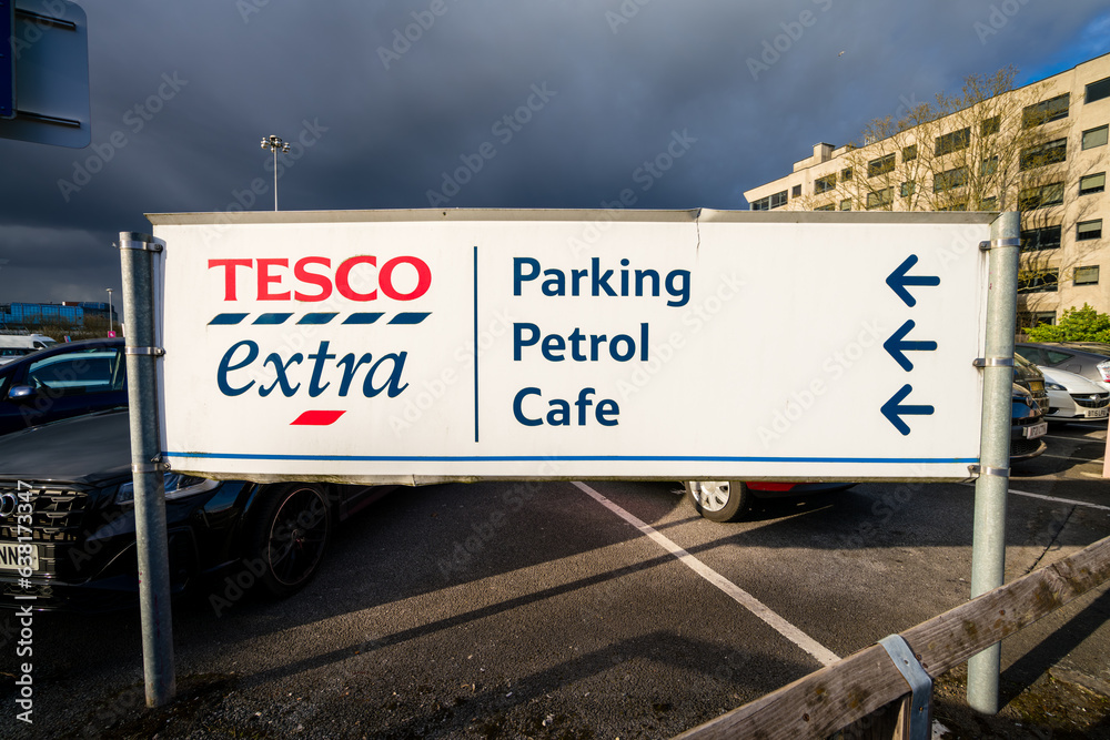 Tesco Extra supermarket sign with Parking, Petrol and Cafe information ...
