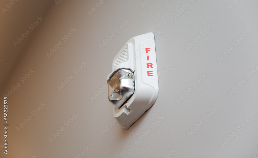 Vivid fire alarm, a symbol of urgency and safety, warns of danger ...