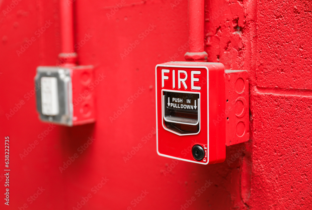 Vivid fire alarm, a symbol of urgency and safety, warns of danger ...
