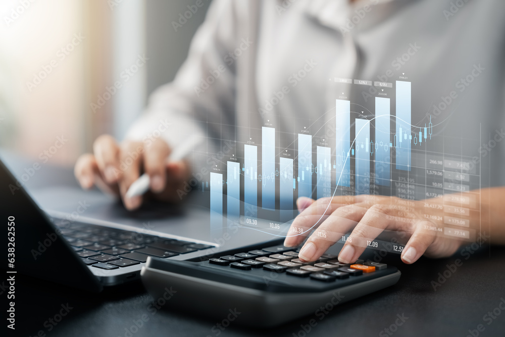 Businesswoman use laptop and calculator analyzing company growth ...