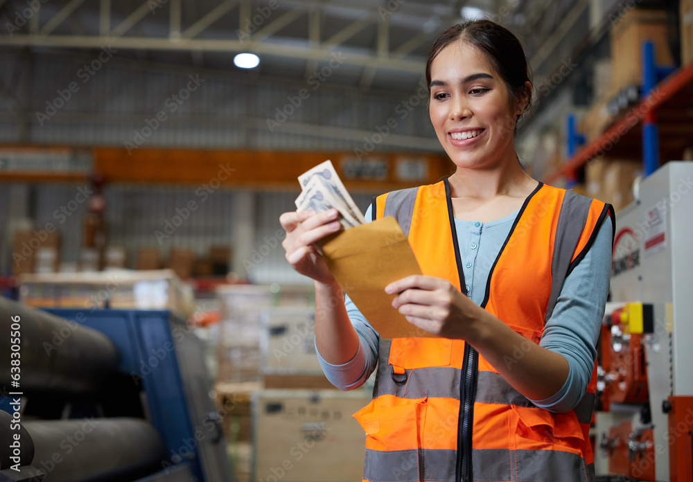 factory worker smiling and counting money from envelope in the ...