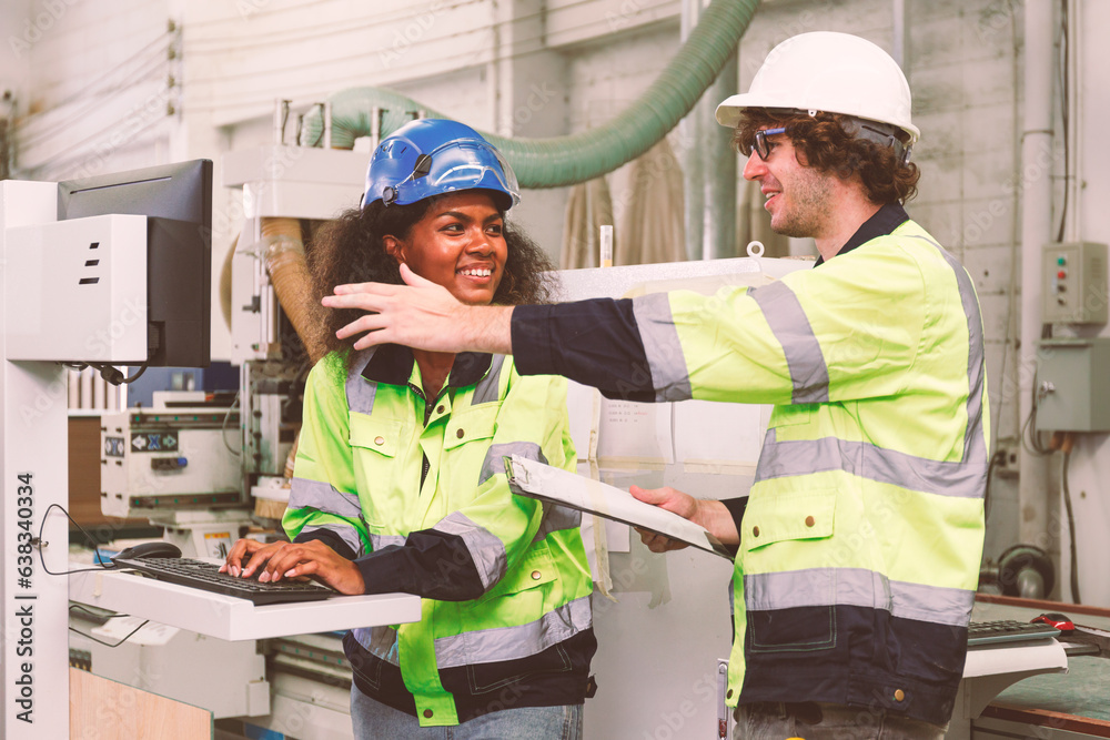 Portrait of an engineering team of men and women in safety uniforms ...